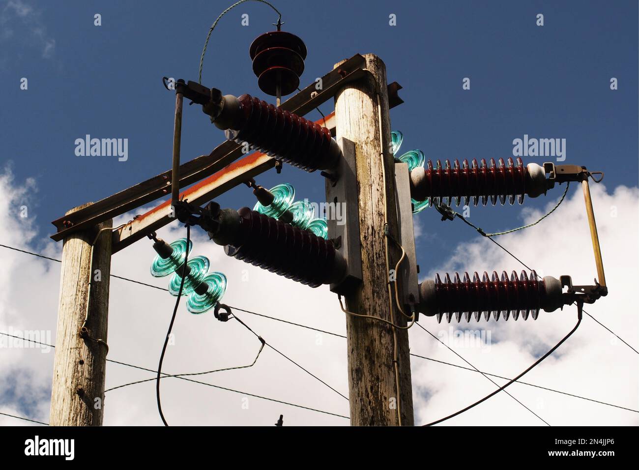 A utility pole carrying various wires and services to local properties ...
