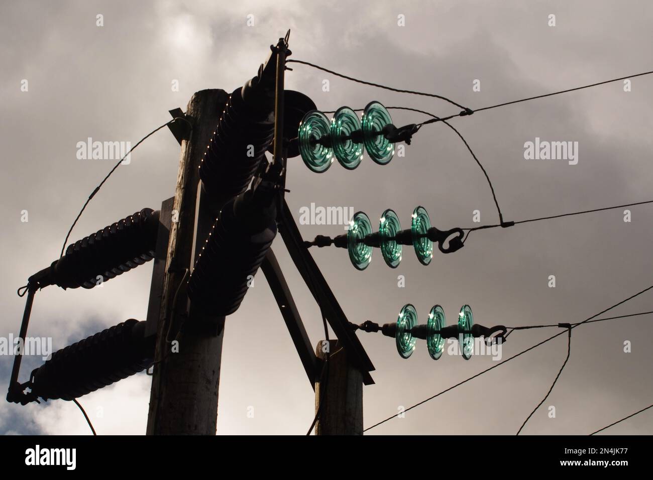 A utility pole carrying various wires and services to local properties ...