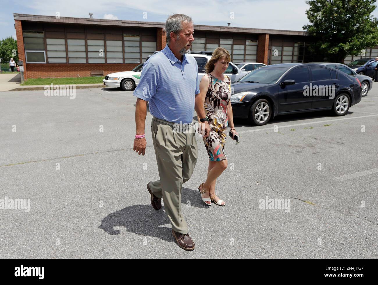David and Kim Hodgin leave a hearing in juvenile court Wednesday, June ...