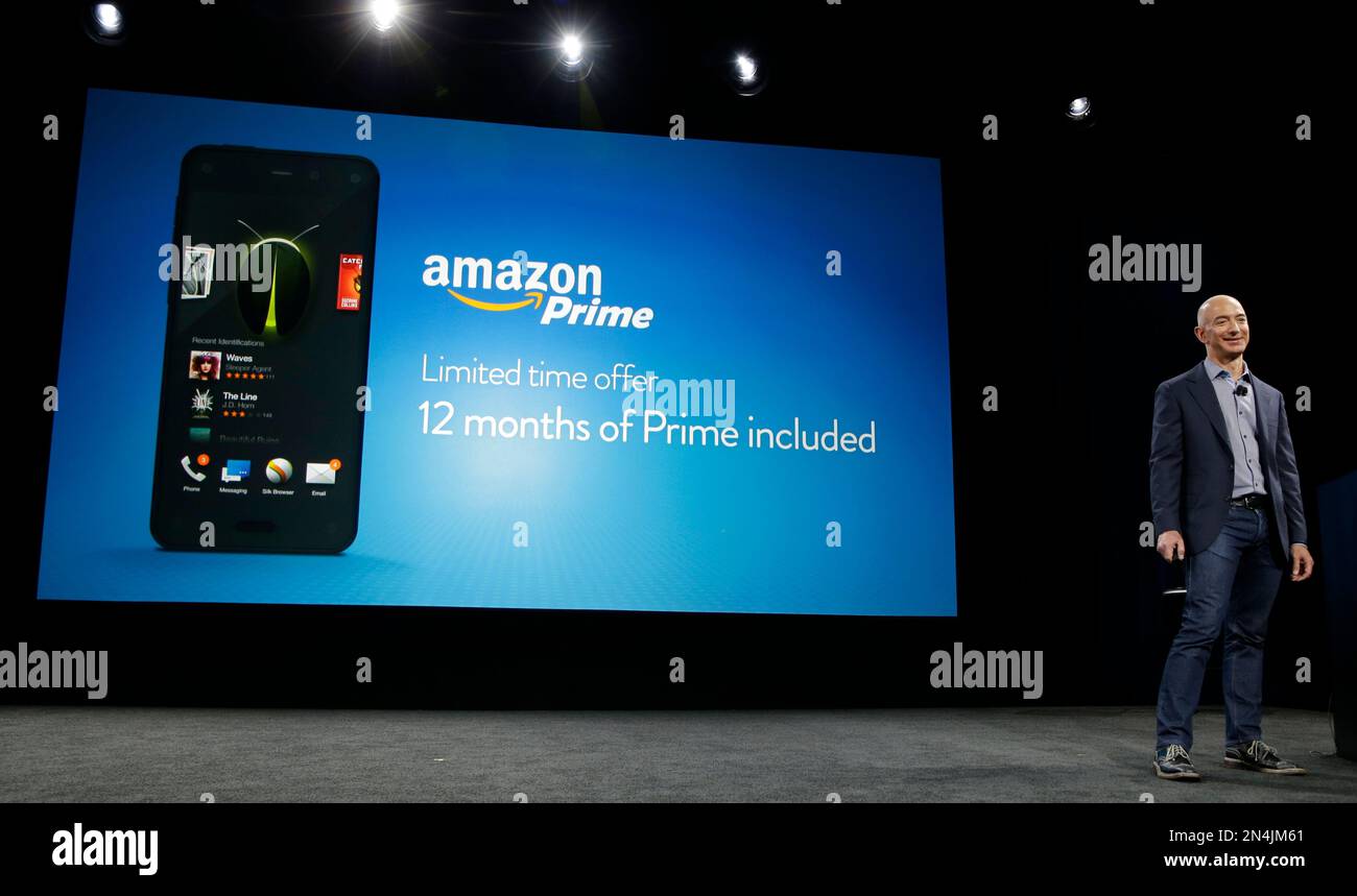 Amazon CEO Jeff Bezos stands next to a graphic that shows that the new ...