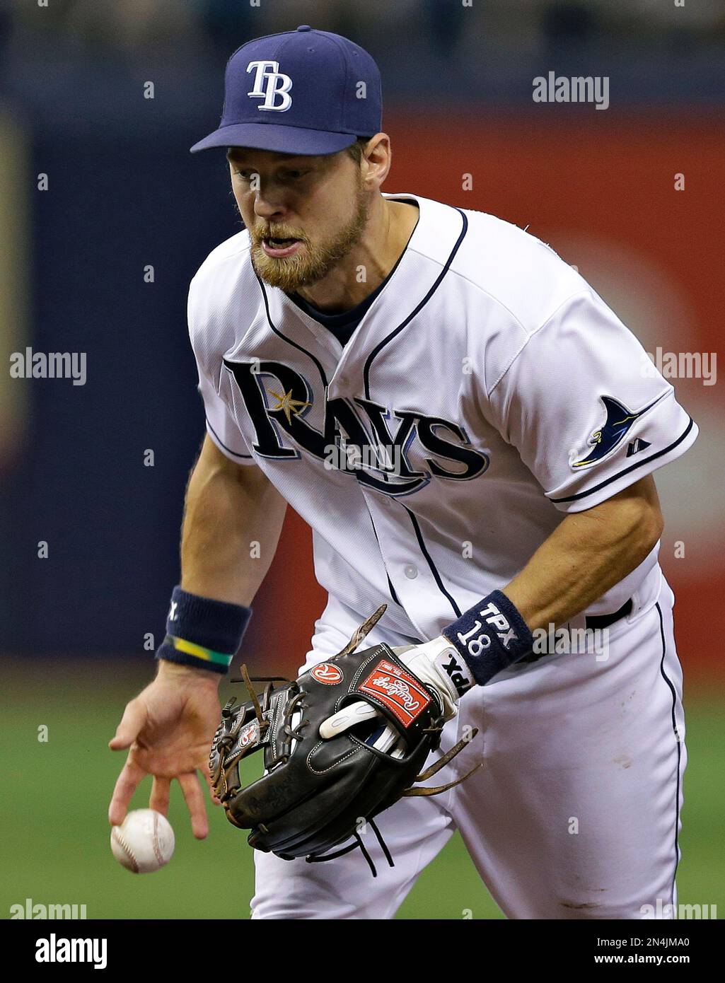 Tampa Bay Rays second baseman Ben Zobrist makes an error on a ground ...