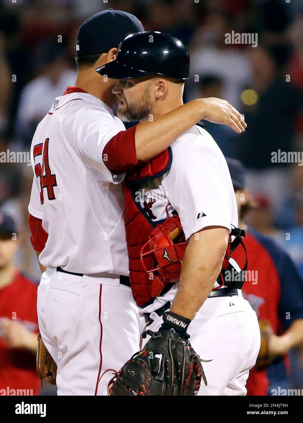 Boston Red Sox closer Edward Mujica, left, hugs catcher David Ross after they defeated the ...
