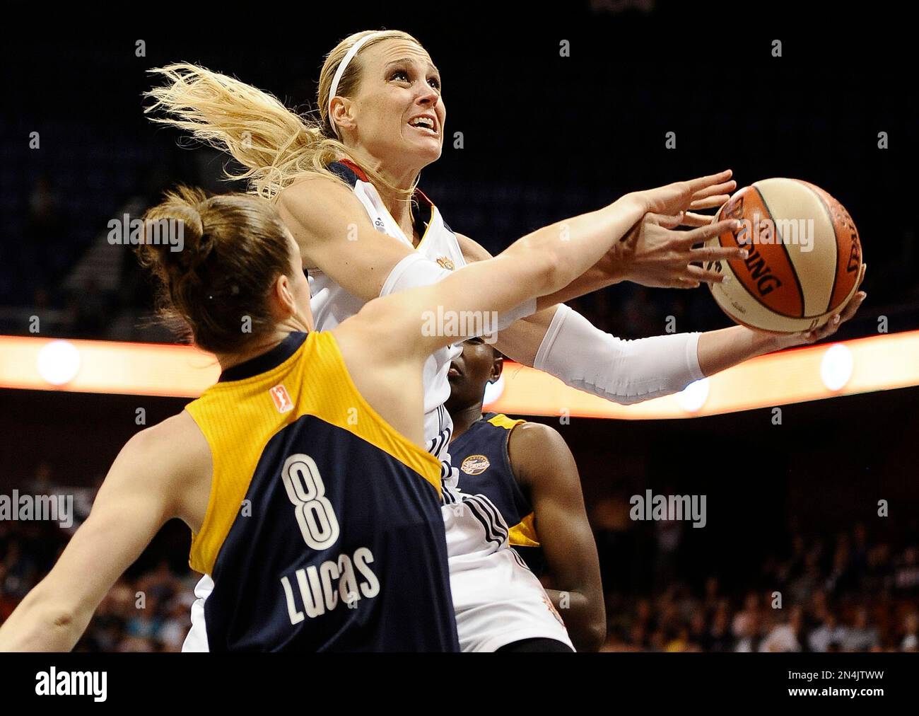 Indian Fever’s Maggie Lucas, left, fouls Connecticut Sun’s Katie ...