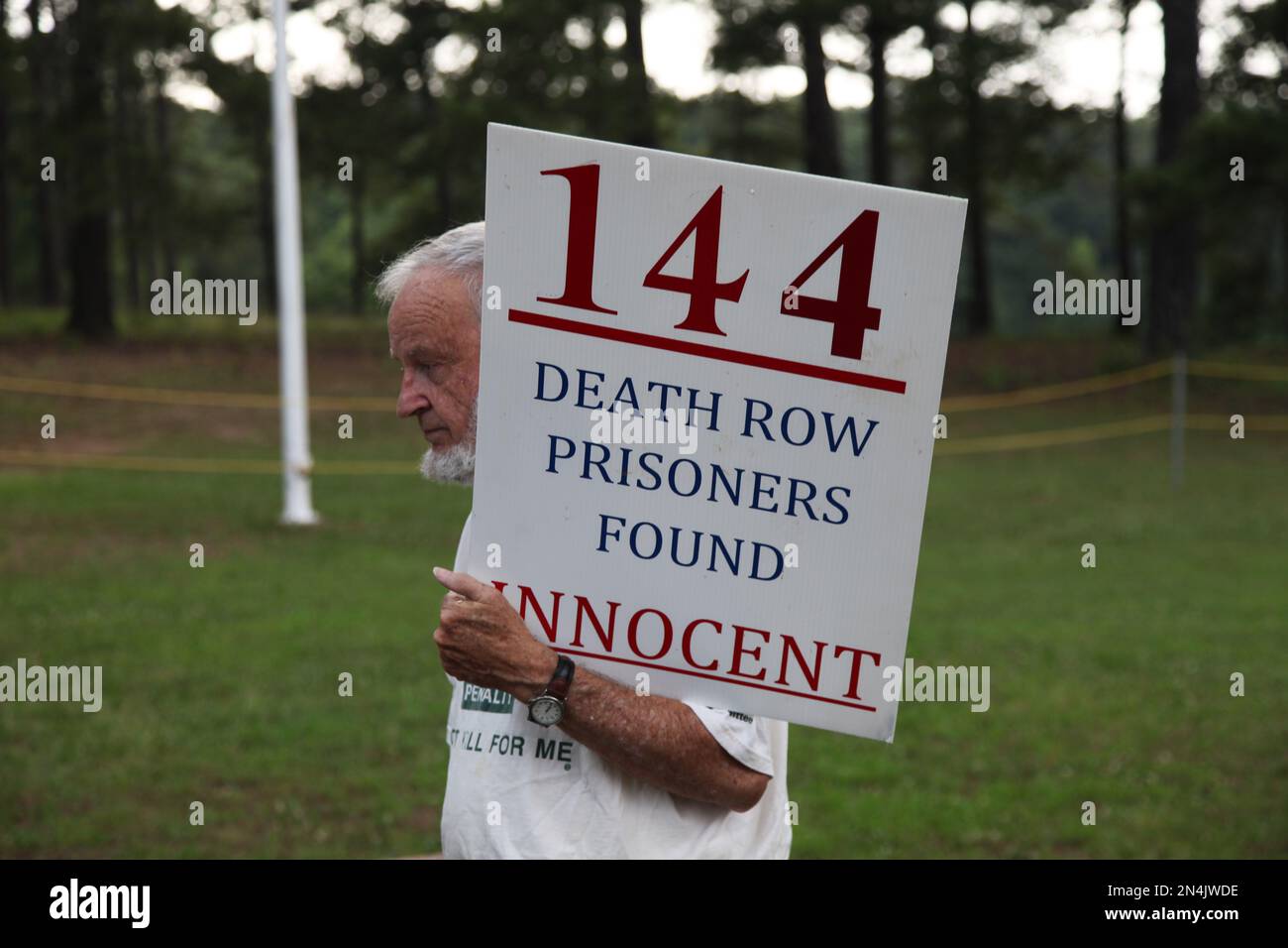 An unidentified death penalty opponent stands on the grounds of the ...