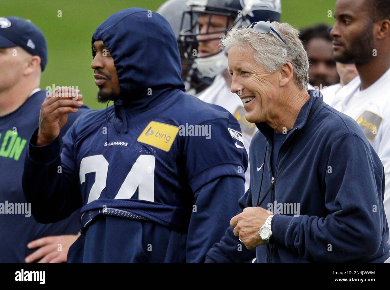 Seattle Seahawks head coach Pete Carroll, right, laughs as he stands ...