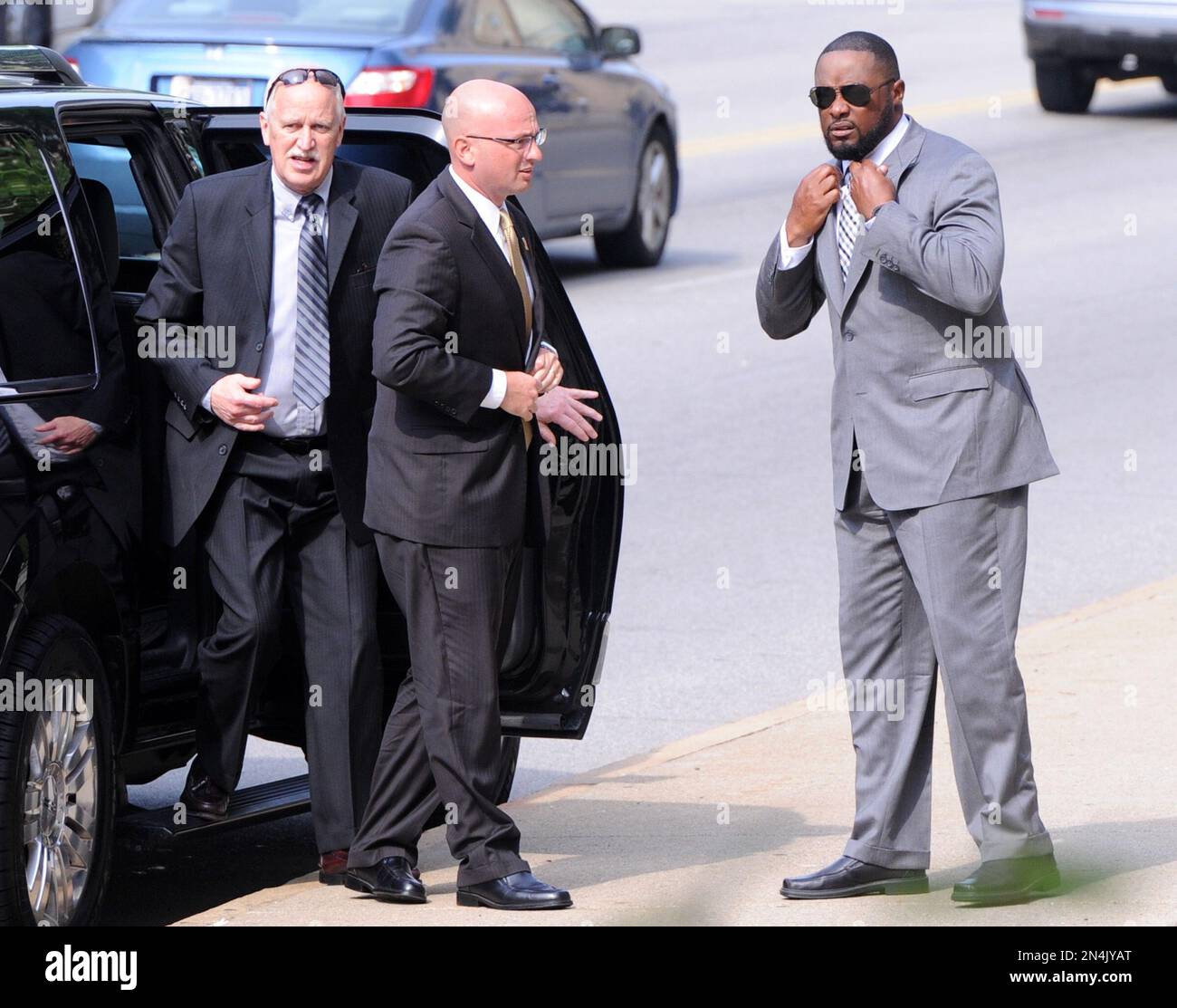 Pittsburgh steeler coach Mike Tomlin, right, attends the funeral of The ...