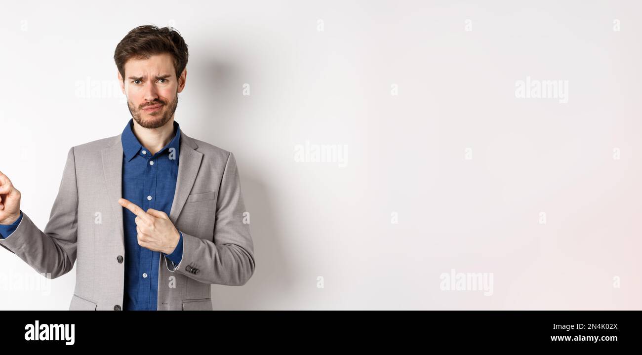 Bad idea. Displeased skeptical guy in business suit smirk and frown ...