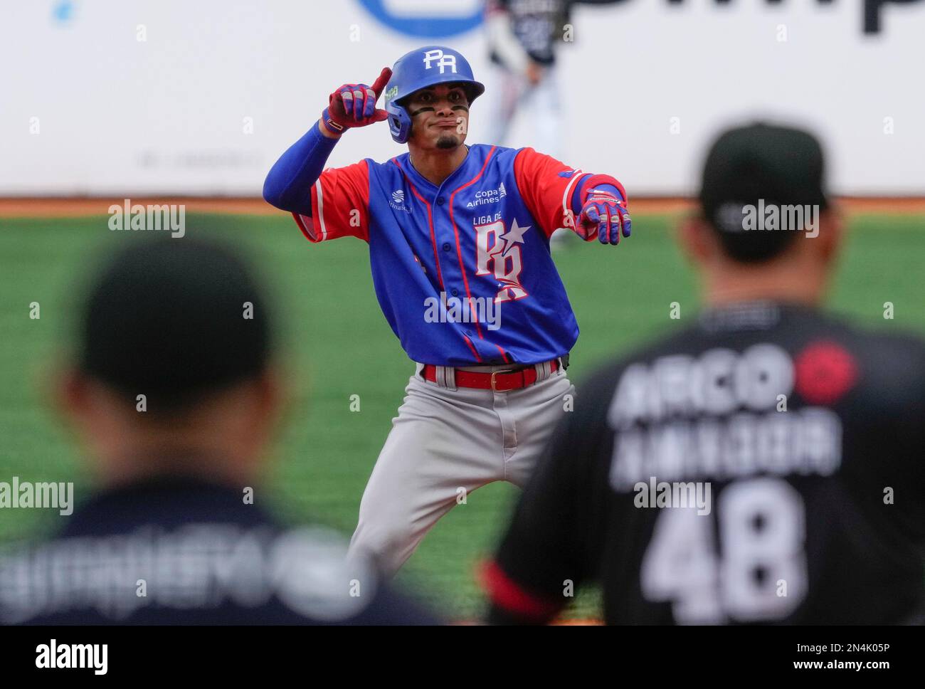 Puerto Rico's Bryan Torres celebrates after connecting a double against ...