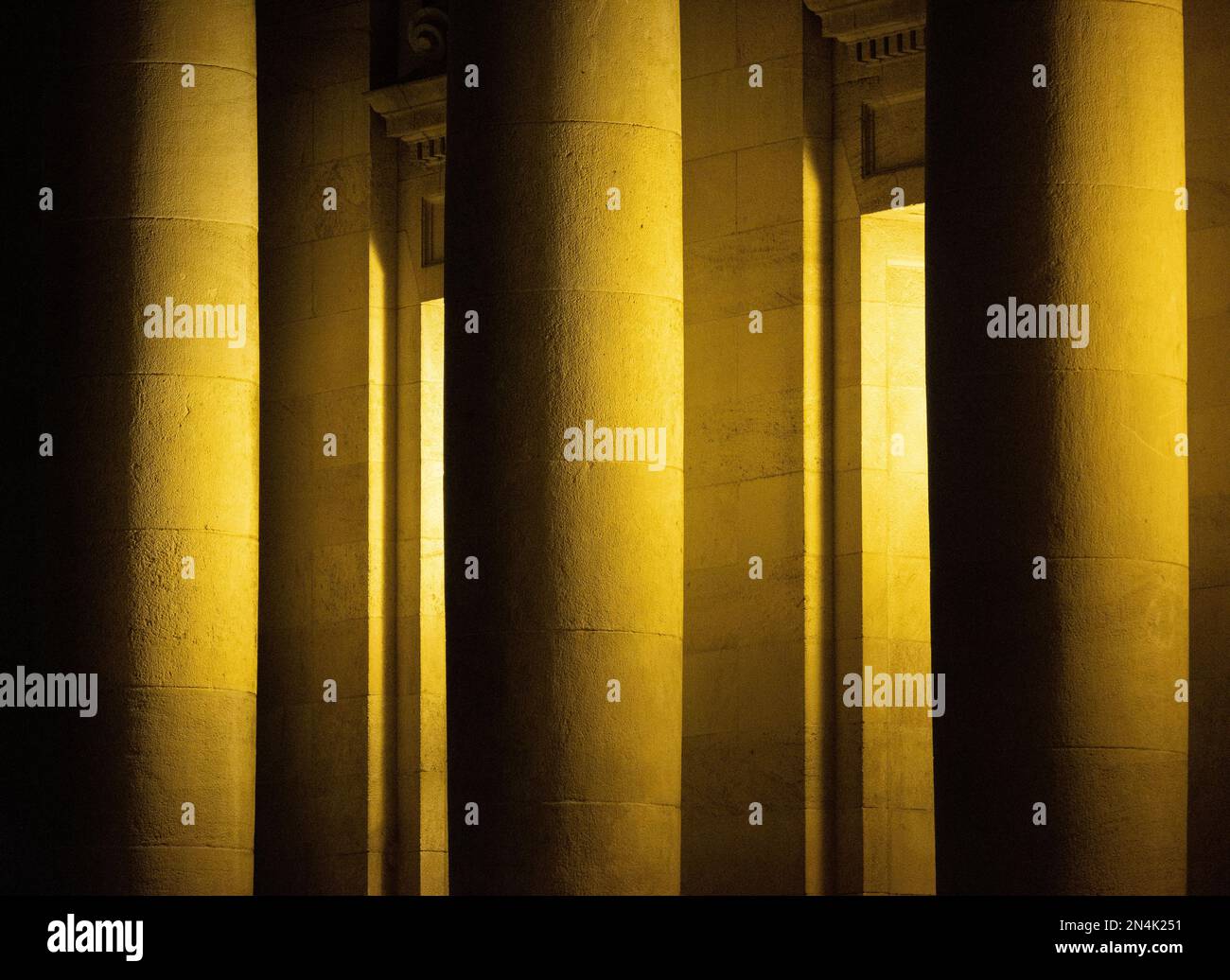 The architecture of lighted tall columns at night Stock Photo - Alamy