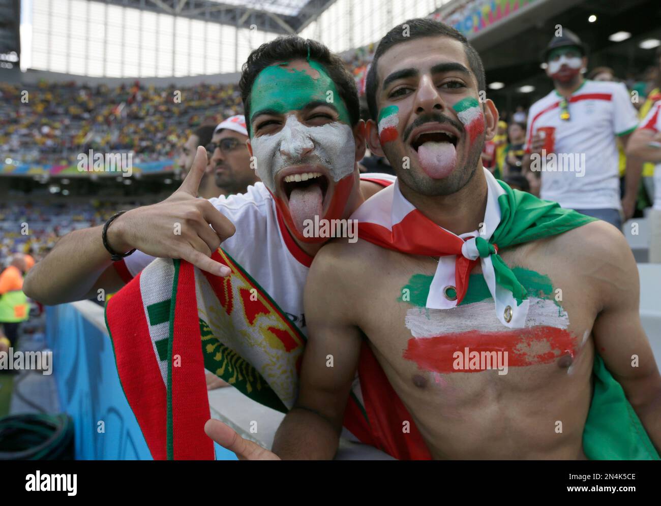 Iranian supporters react before the group F World Cup soccer match ...