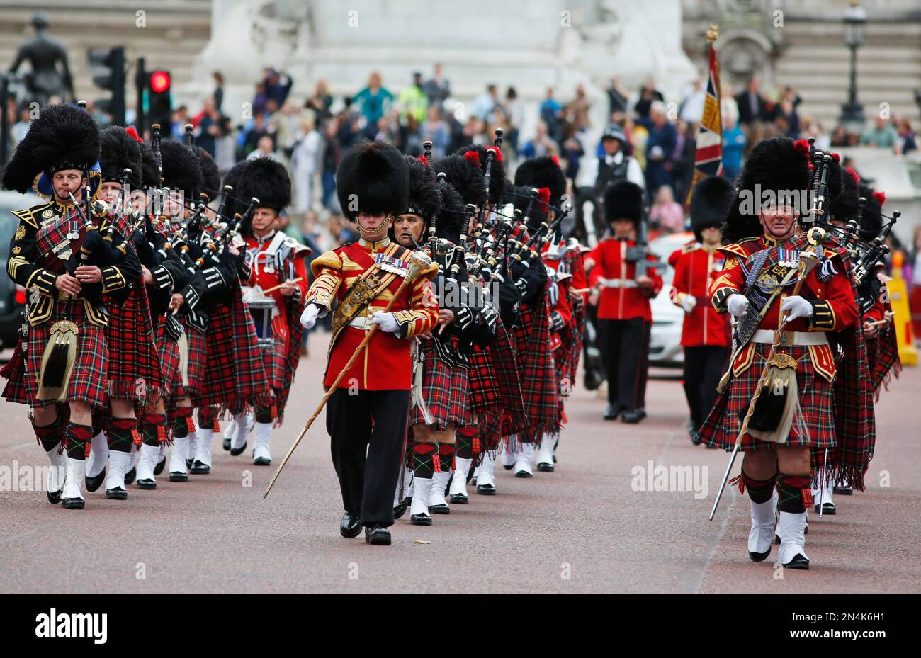 Members of the Vancouver Police Pipe Band march in central London, as ...