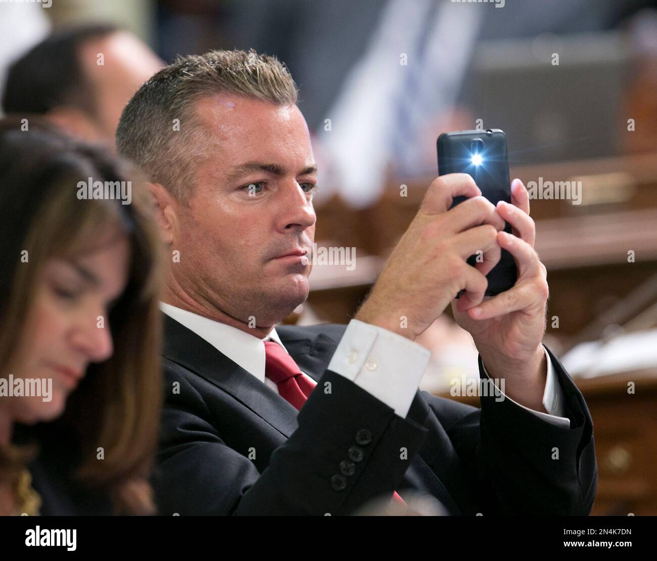 Assemblyman Travis Allen,R-Huntington Beach, takes a photo with his ...