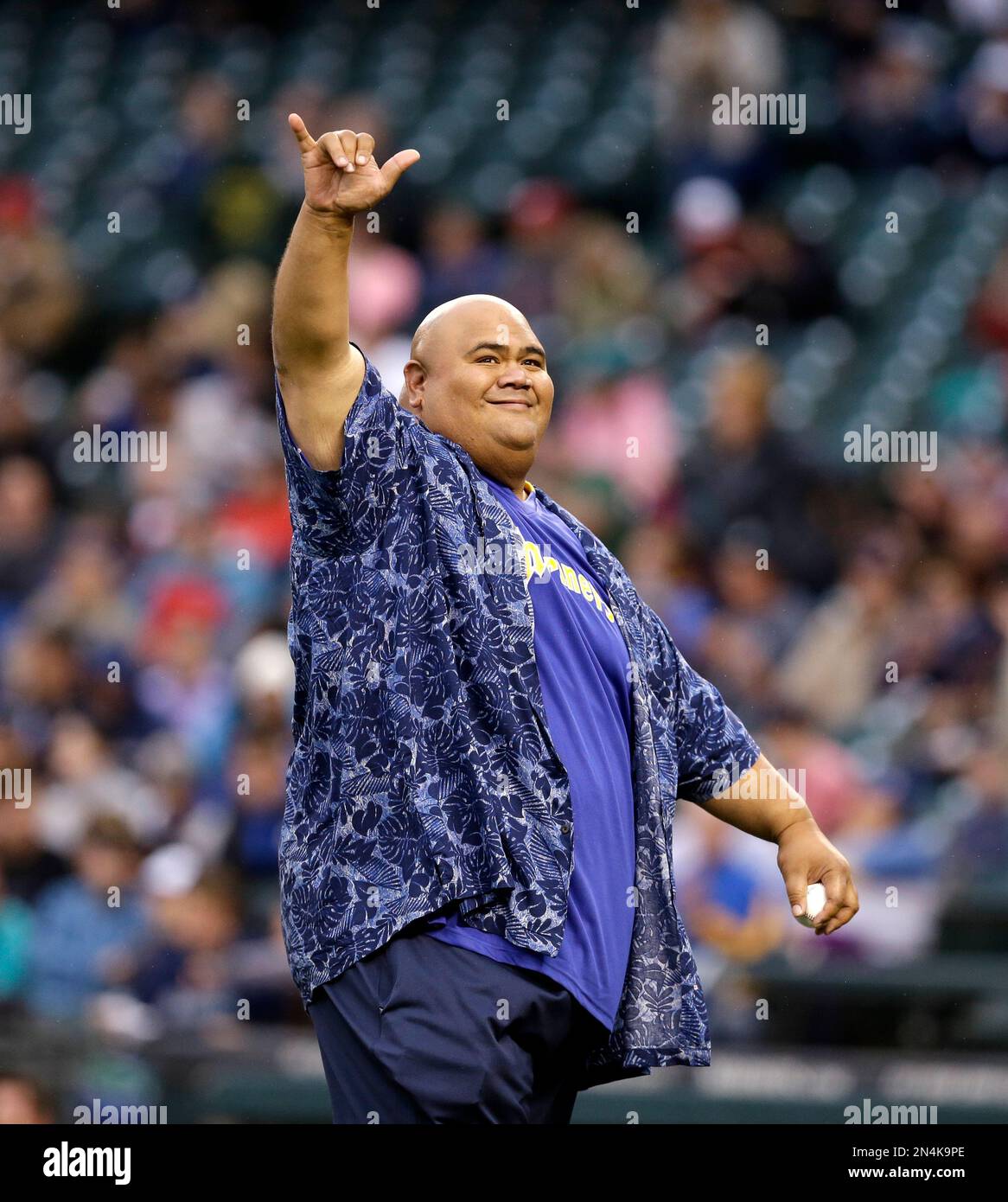 Actor Taylor Wily, of Hawaii Five-0, motions to fans after throwing out ...