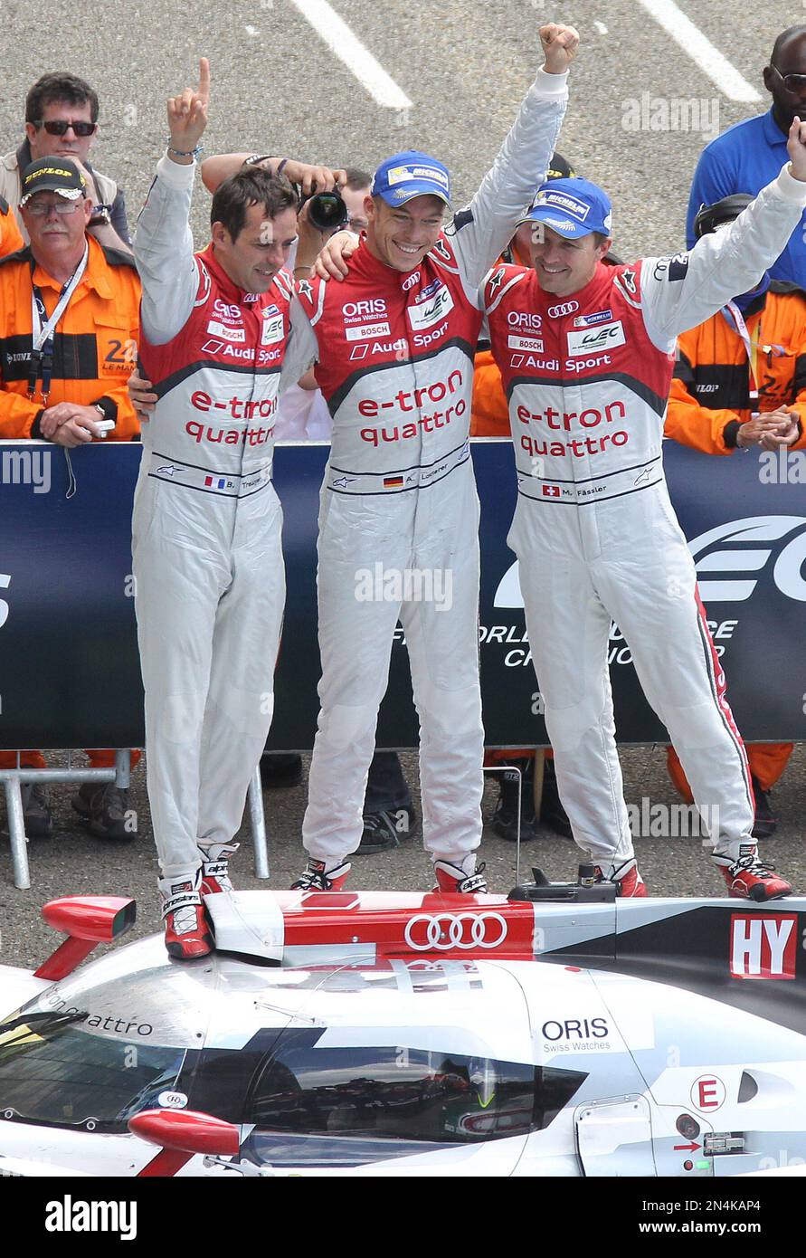 The Audi R18 e-tron quattro team, from left, France's Benoit Treluyer ...