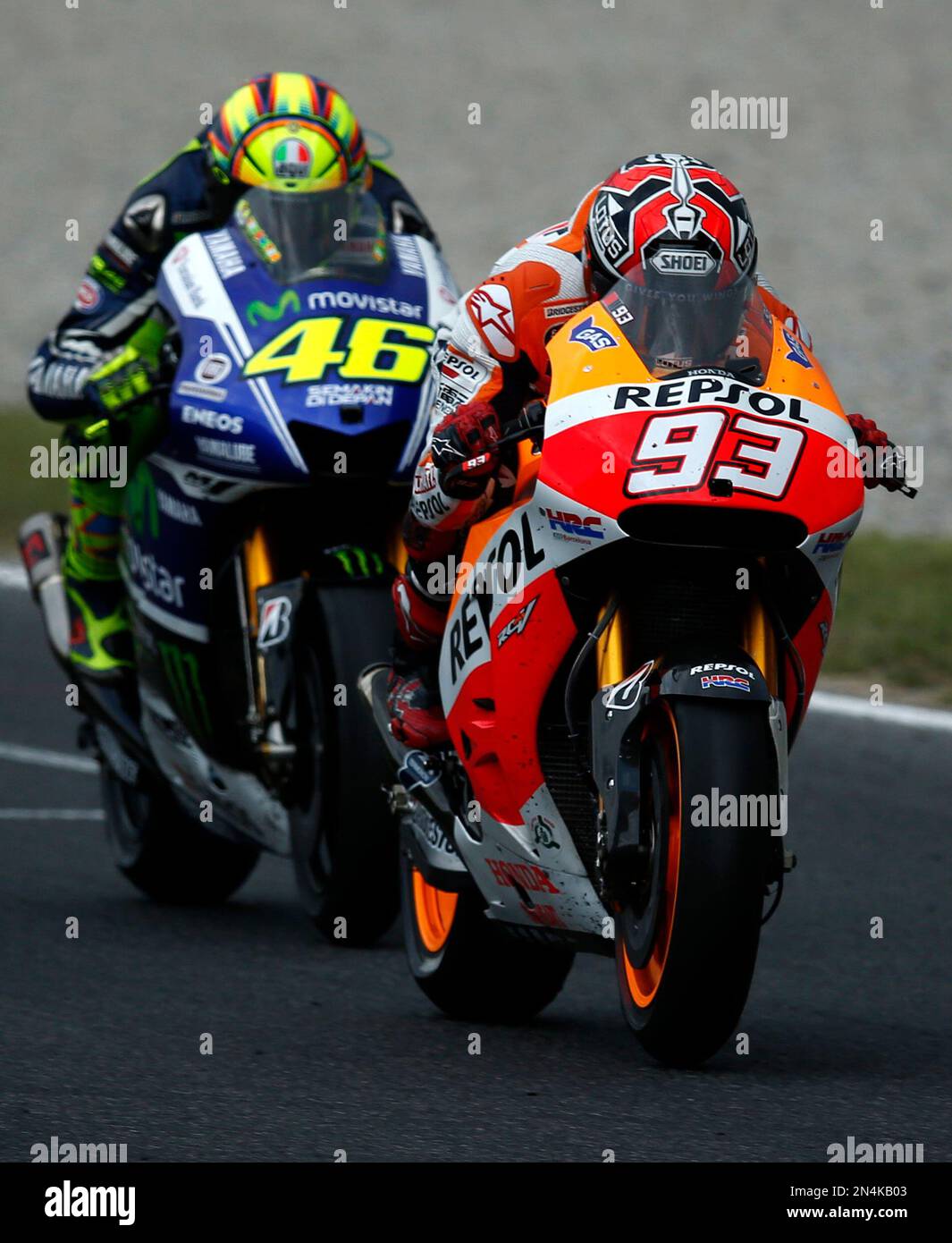 MotoGP raider Marc Marquez of Spain is followed by Valentino Rossi of ...