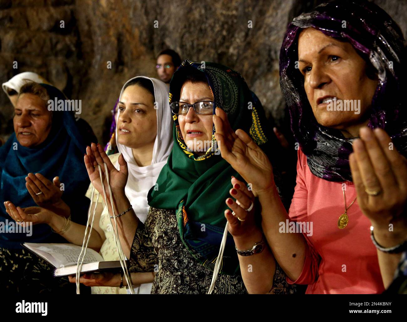 In this Friday, June 13, 2014 photo, Zoroastrians pray in Chak Chak, a ...