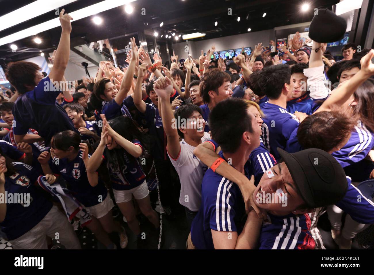 Japanese soccer fans celebrate after Japan's first scoring goal by ...