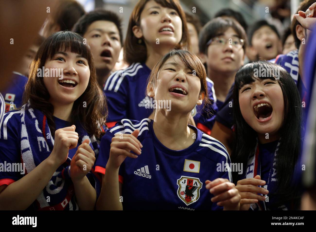 Japanese soccer fans watch a live broadcast of the group C World Cup ...