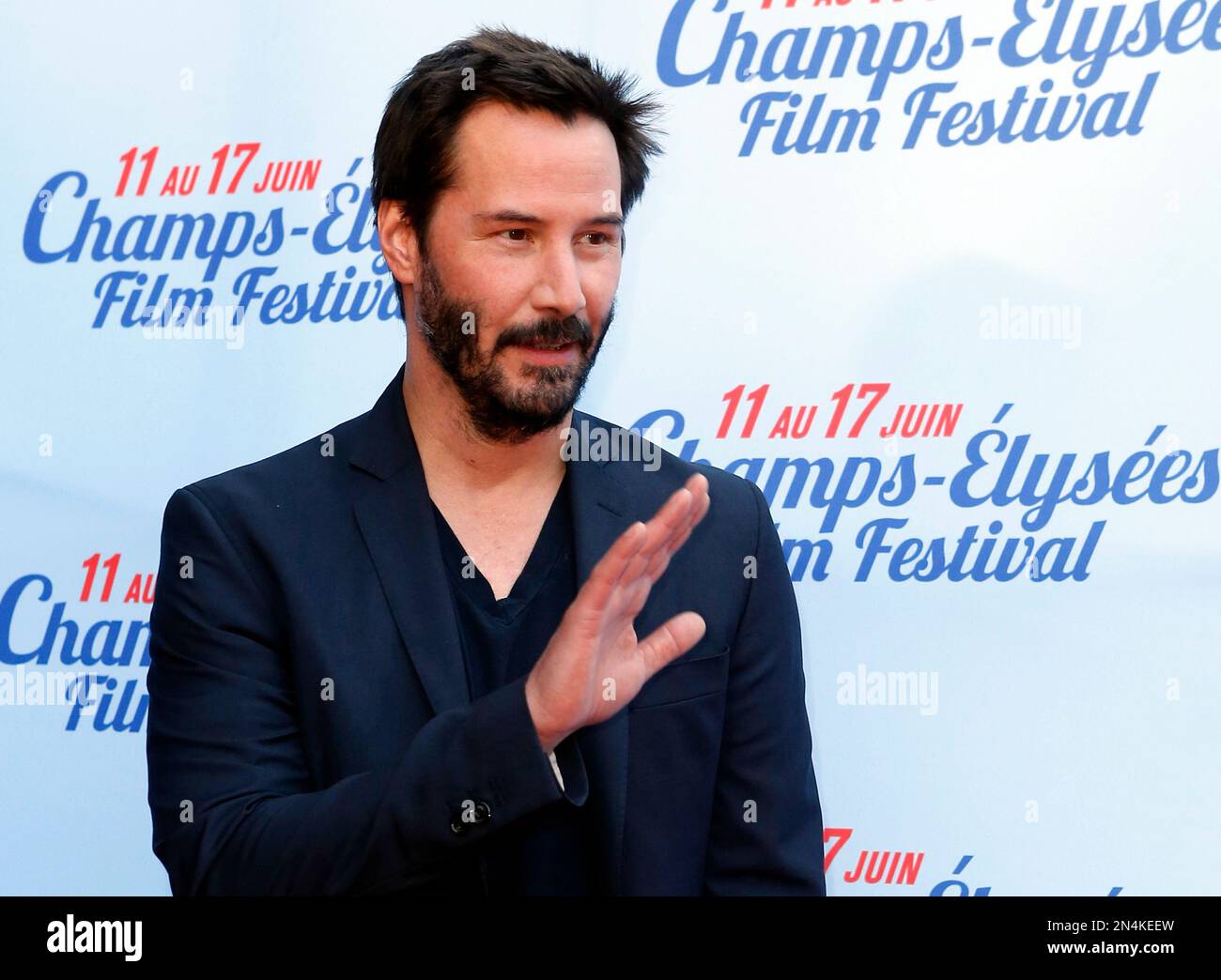 Keanu Reeves waves at the screening of the film "Side by Side" during ...