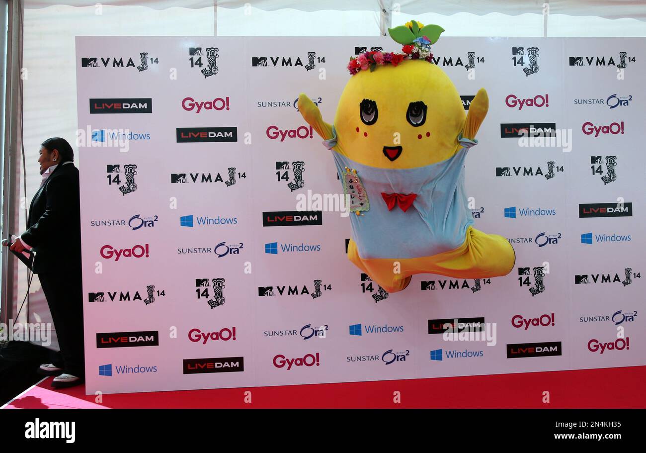 Japanese mascot character “Funassyi" jumps as he poses for ...