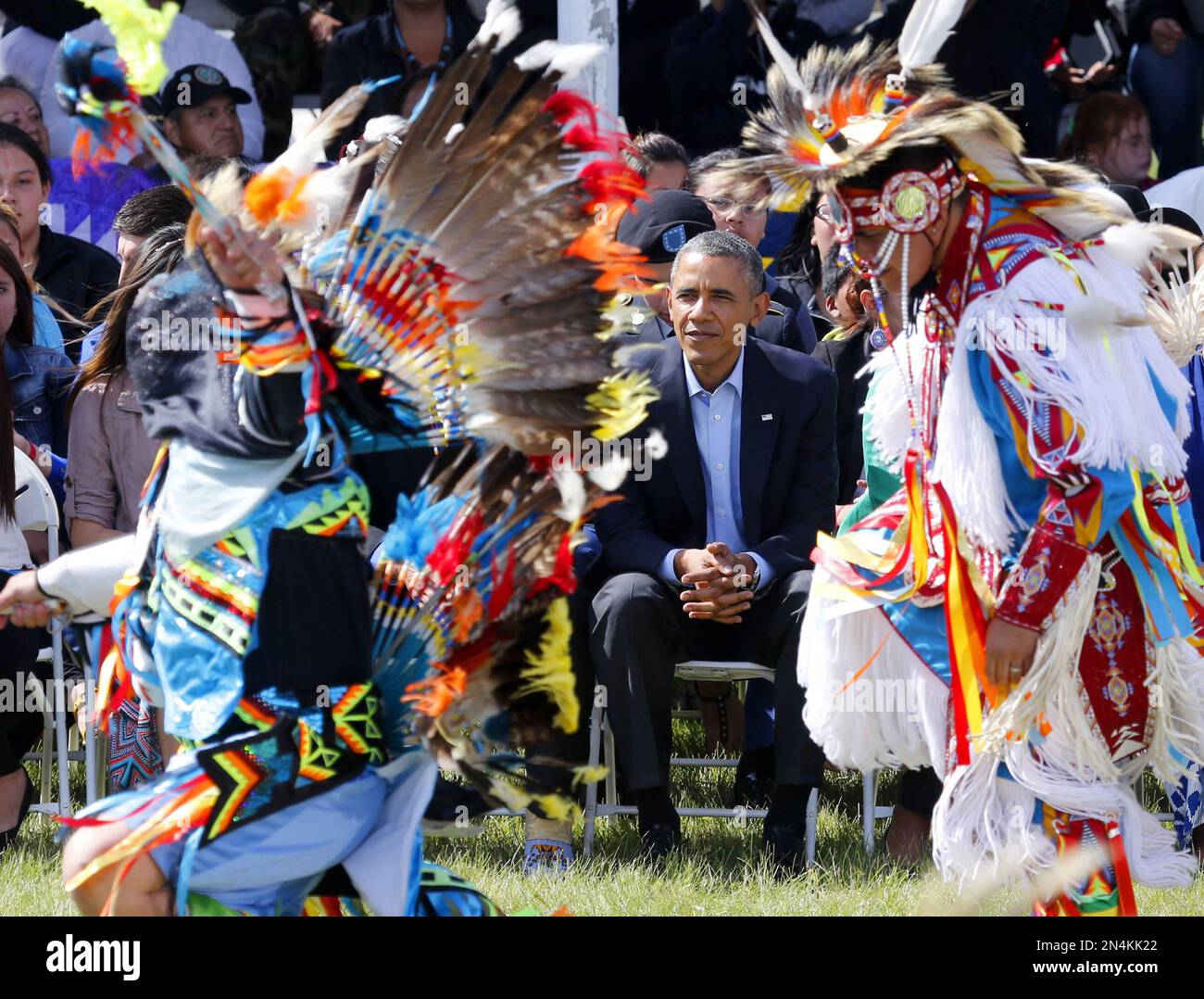 President Barack Obama watches Native American male dancers on the ...