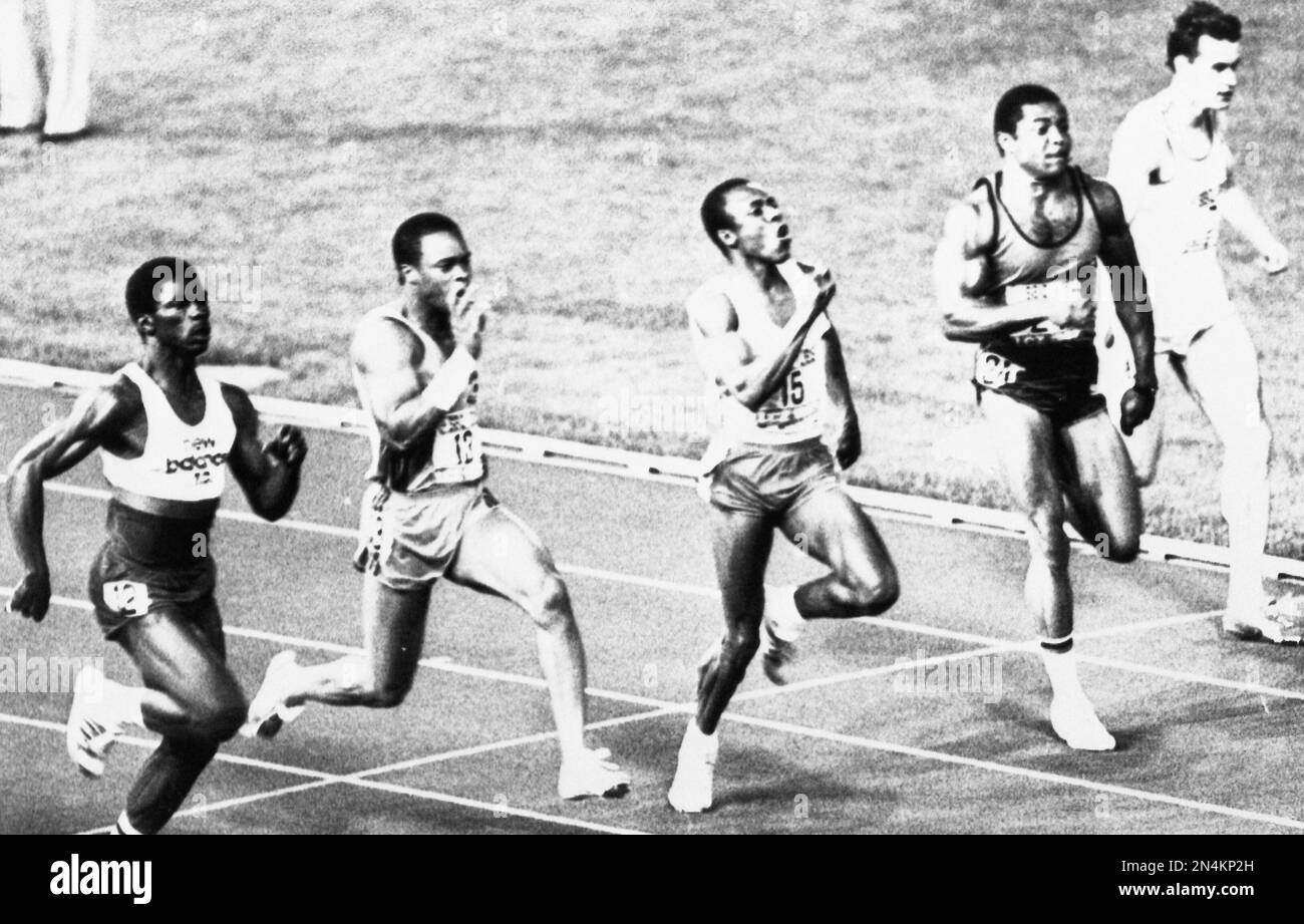 America's Calvin Smith, third from left, heading towards the finish ...