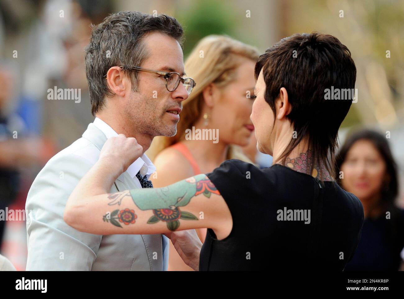 Guy Pearce, left, a cast member in "The Rover," is primped by his wife ...
