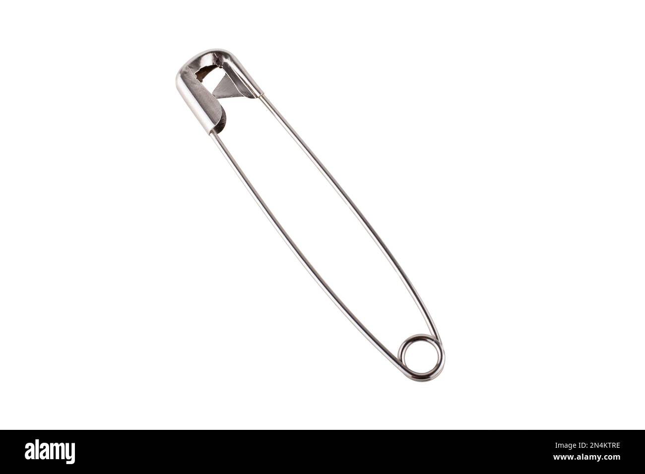 Closed safety pin isolated on white background Stock Photo - Alamy