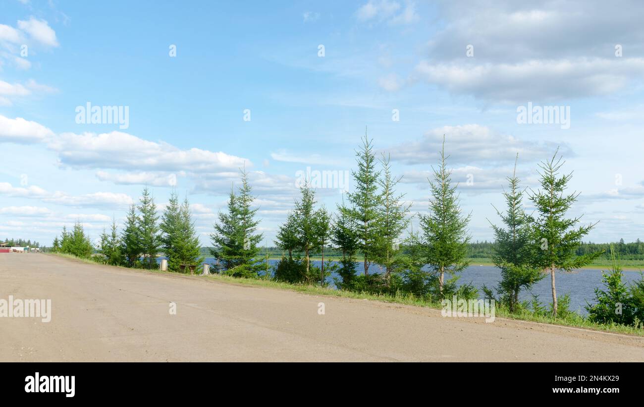 The road in the Northern Yakut village of ulus Suntar goes along the ...