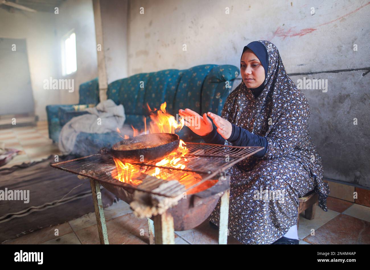 Gaza, Palestine. 08th Feb, 2023. A Palestinian woman seen cooking and ...