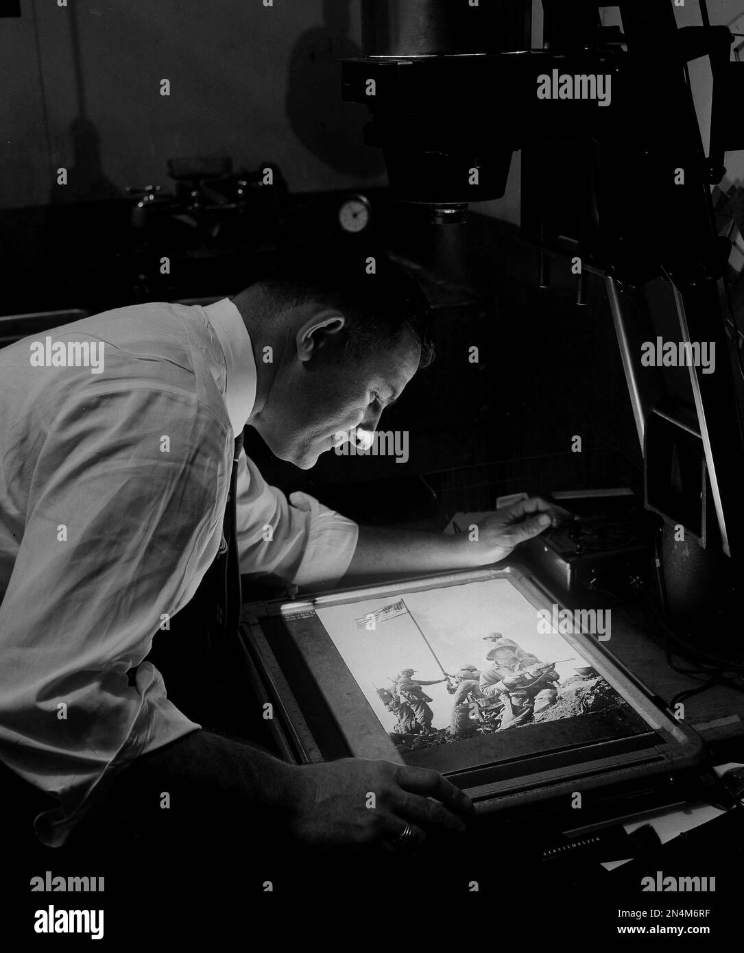 Lou Lowery, photographic director of Leatherneck Magazine, makes a ...