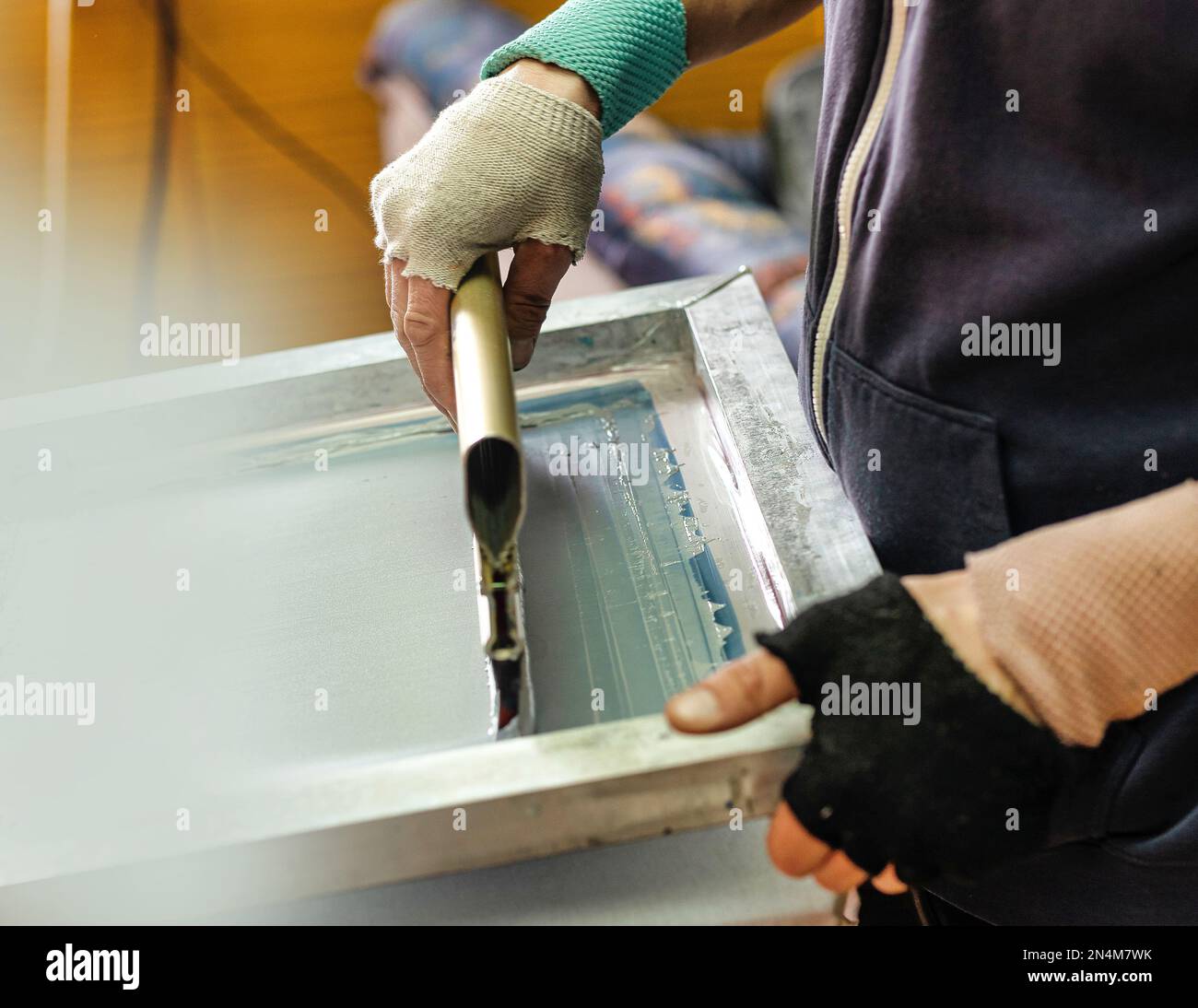 Hand pressing silk screen hi-res stock photography and images - Alamy