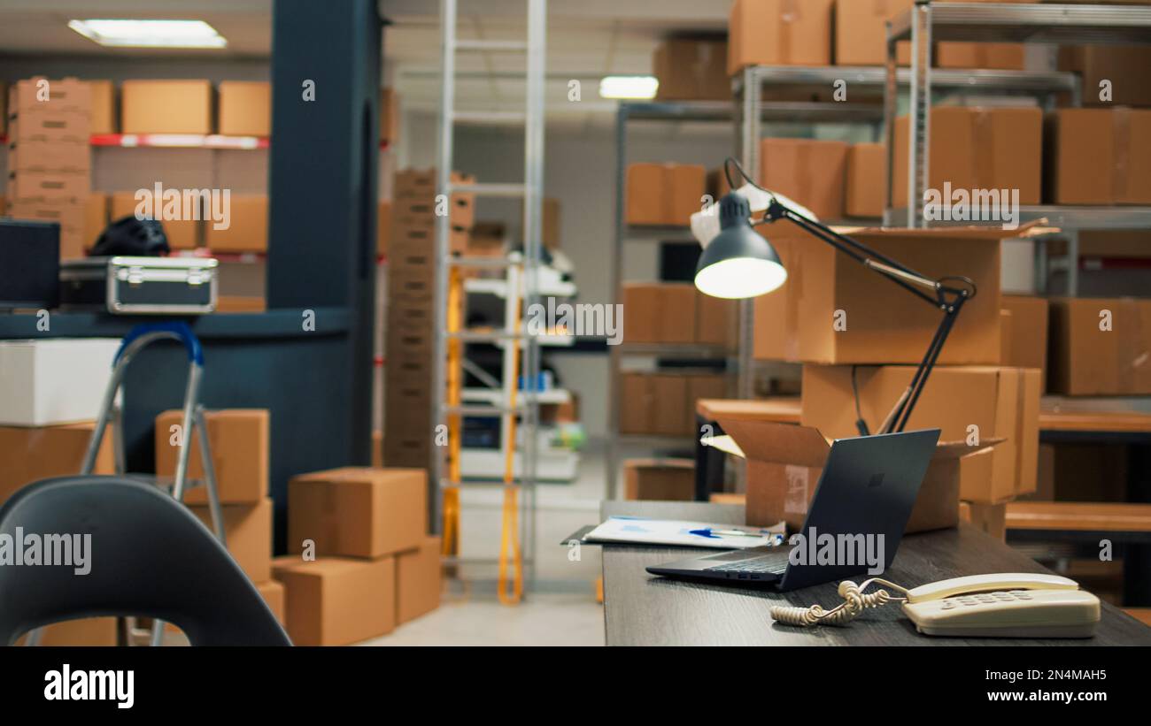 Storehouse filled with raw materials on shelves to put carton packages ...