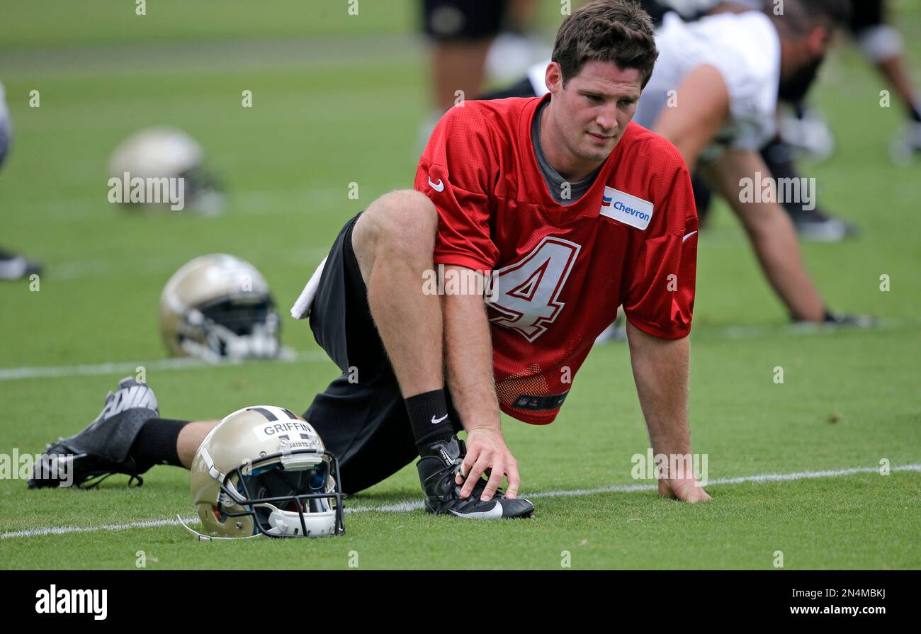 New Orleans Saints quarterback Ryan Griffin (4) stretches during mini ...