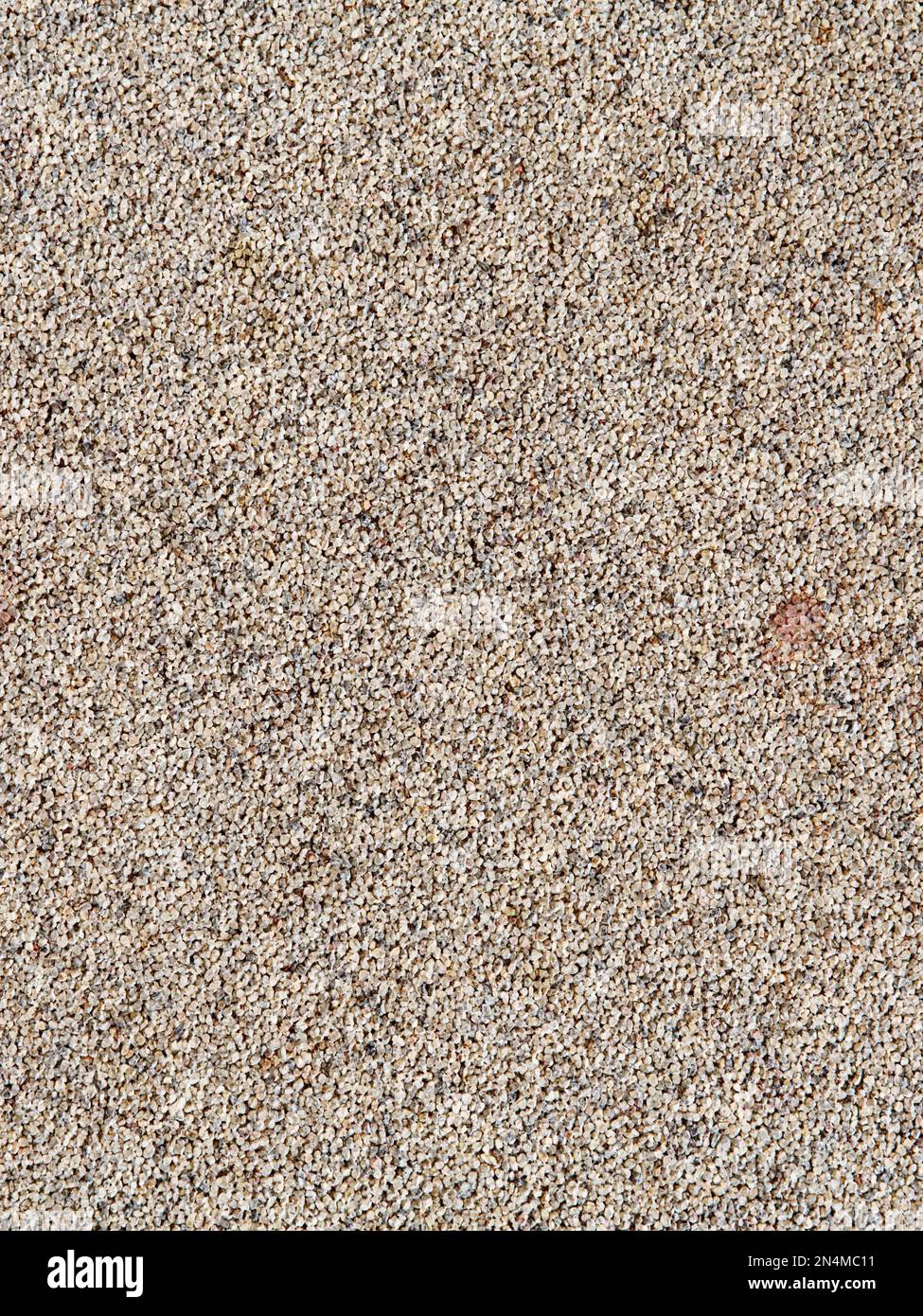 A vertical closeup of quartz sand epoxy decorative floor covering with ...
