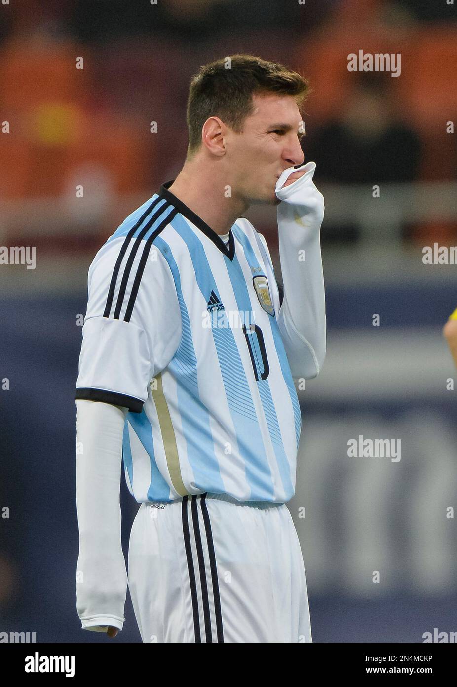 FILE - In this March 5, 2014 file photo, Argentina's Lionel Messi wipes ...