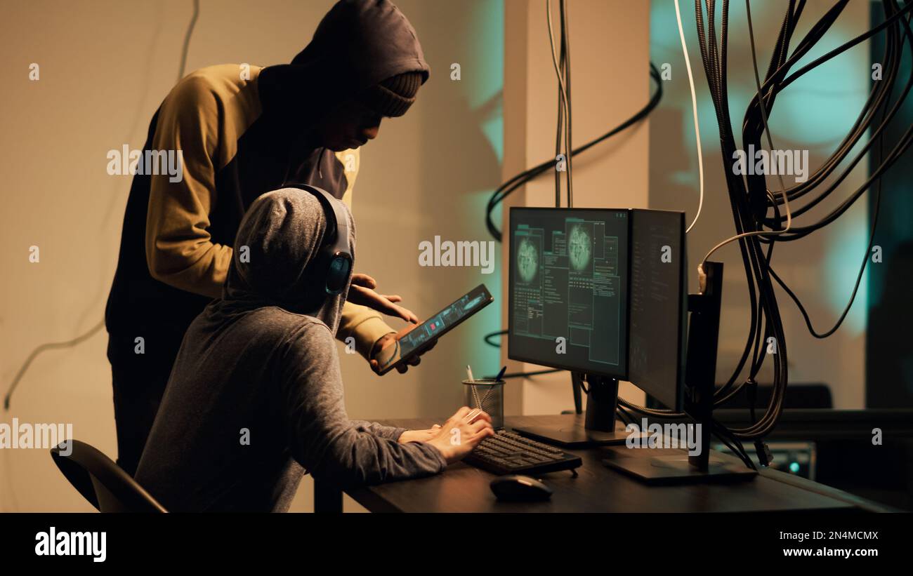 Woman hacker using her knowledge of computer systems to access information and steal passwords ...