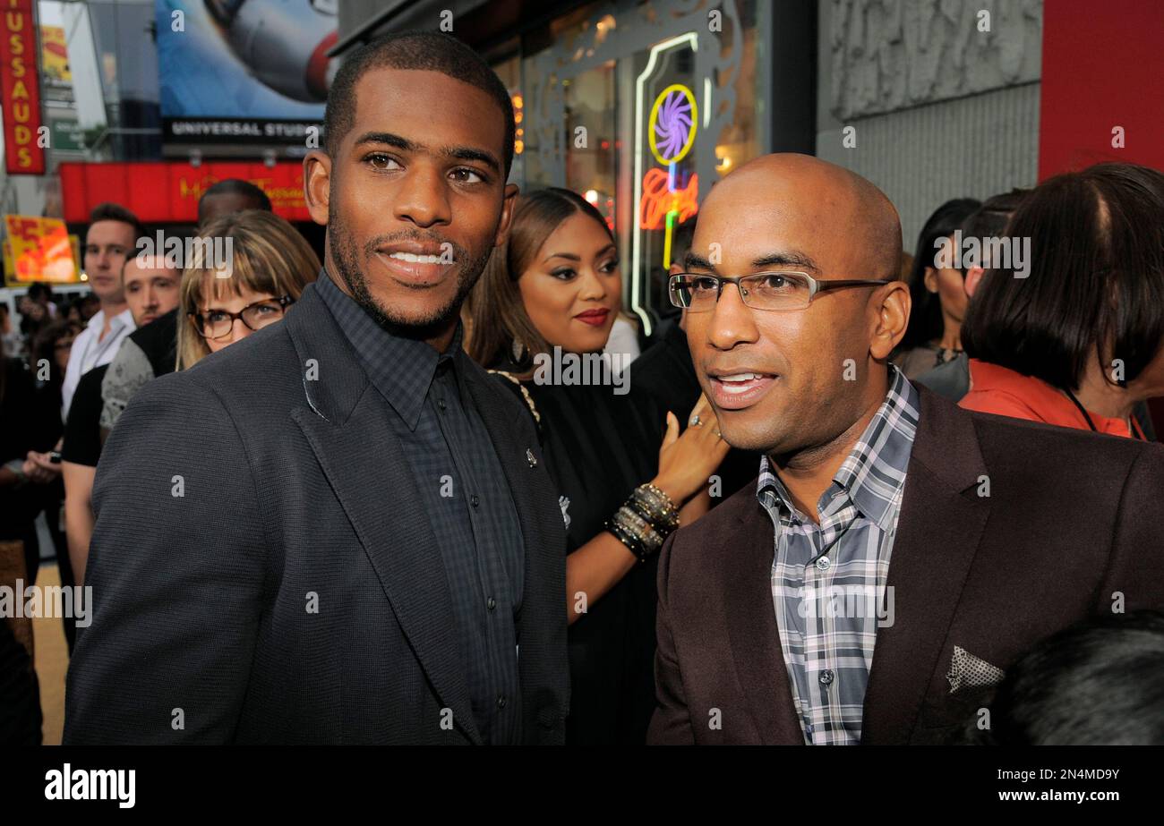 Los Angeles Clippers basketball player Chris Paul, left, poses with Tim ...