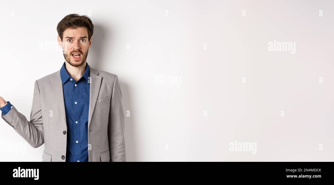 Whats wrong. Confused guy in suit cant understand, looking clueless ...