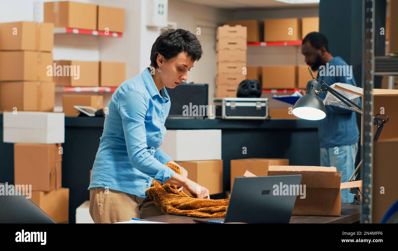 Happy woman using products from storehouse to prepare order, shipping ...