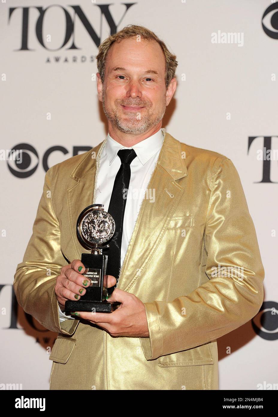 Kevin Adams poses in the press room with his award for best lighting ...