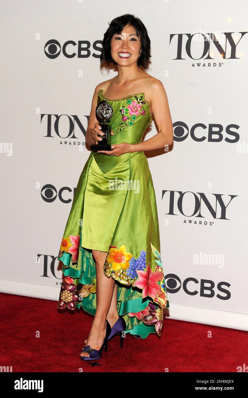 Linda Cho poses in the press room with her award for best costume ...