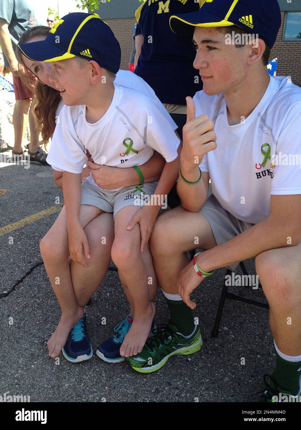 Braden Gandee, 7, sits on the lap of his mother, Danielle Gandee, while ...