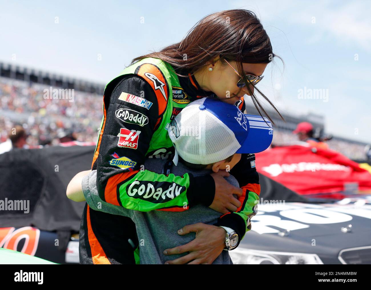 Driver Danica Patrick gets a hug from fan Gavin Trombley, 6, of ...