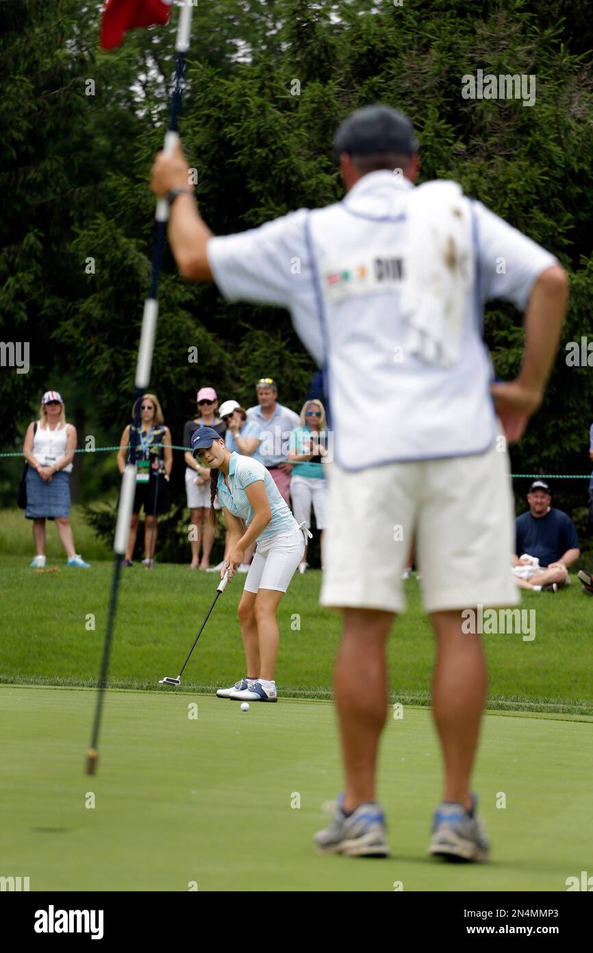 Great Britain and Ireland's Annabel Dimmock putts on the second hole ...