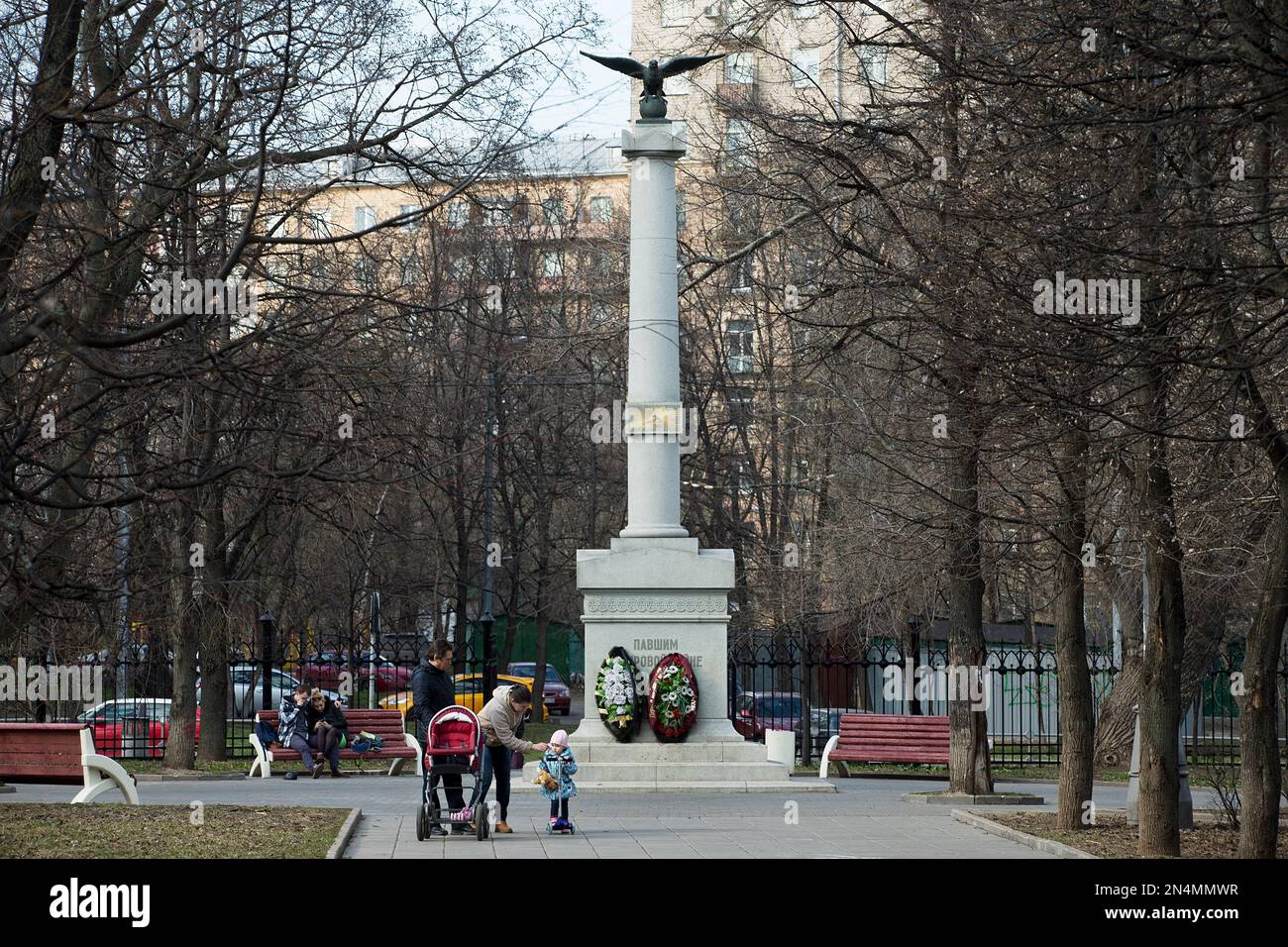 In this April 18, 2014 photo, people walk next to a monument dedicated ...