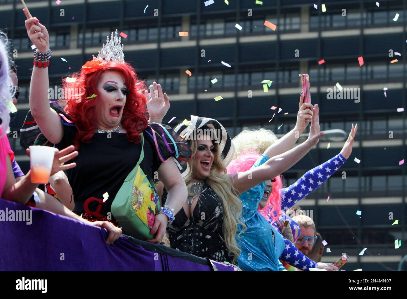 Drag queens wave to spectators during the annual Pride Day Parade ...