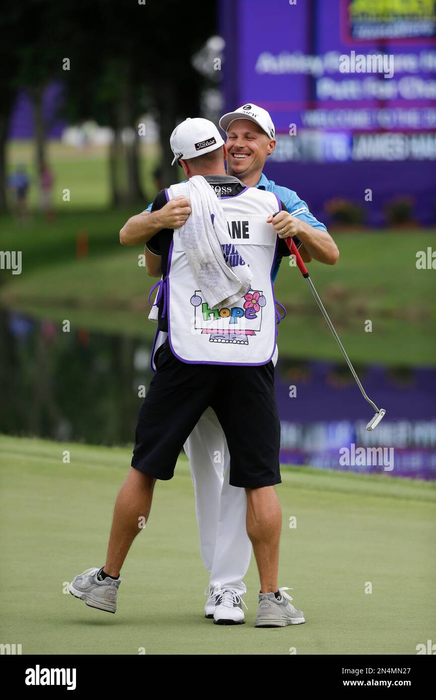 Ben Crane hugs his caddie, Joel Stock, on the 18th green after Crane ...