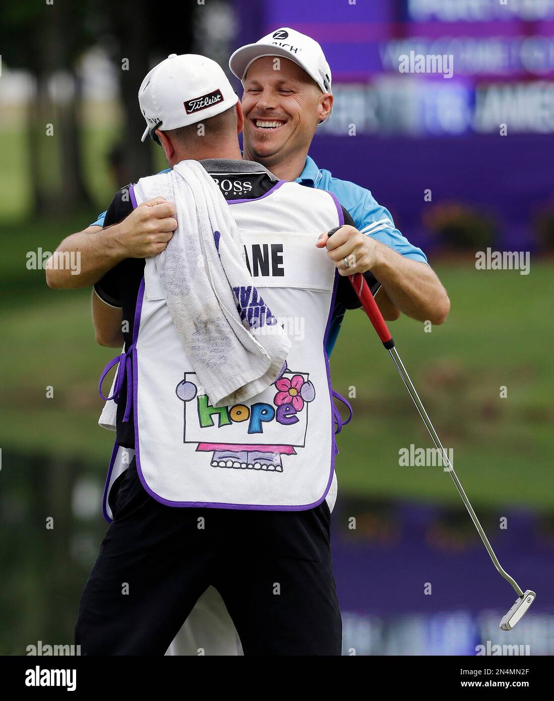 Ben Crane hugs his caddie, Joel Stock, on the 18th green after Crane ...