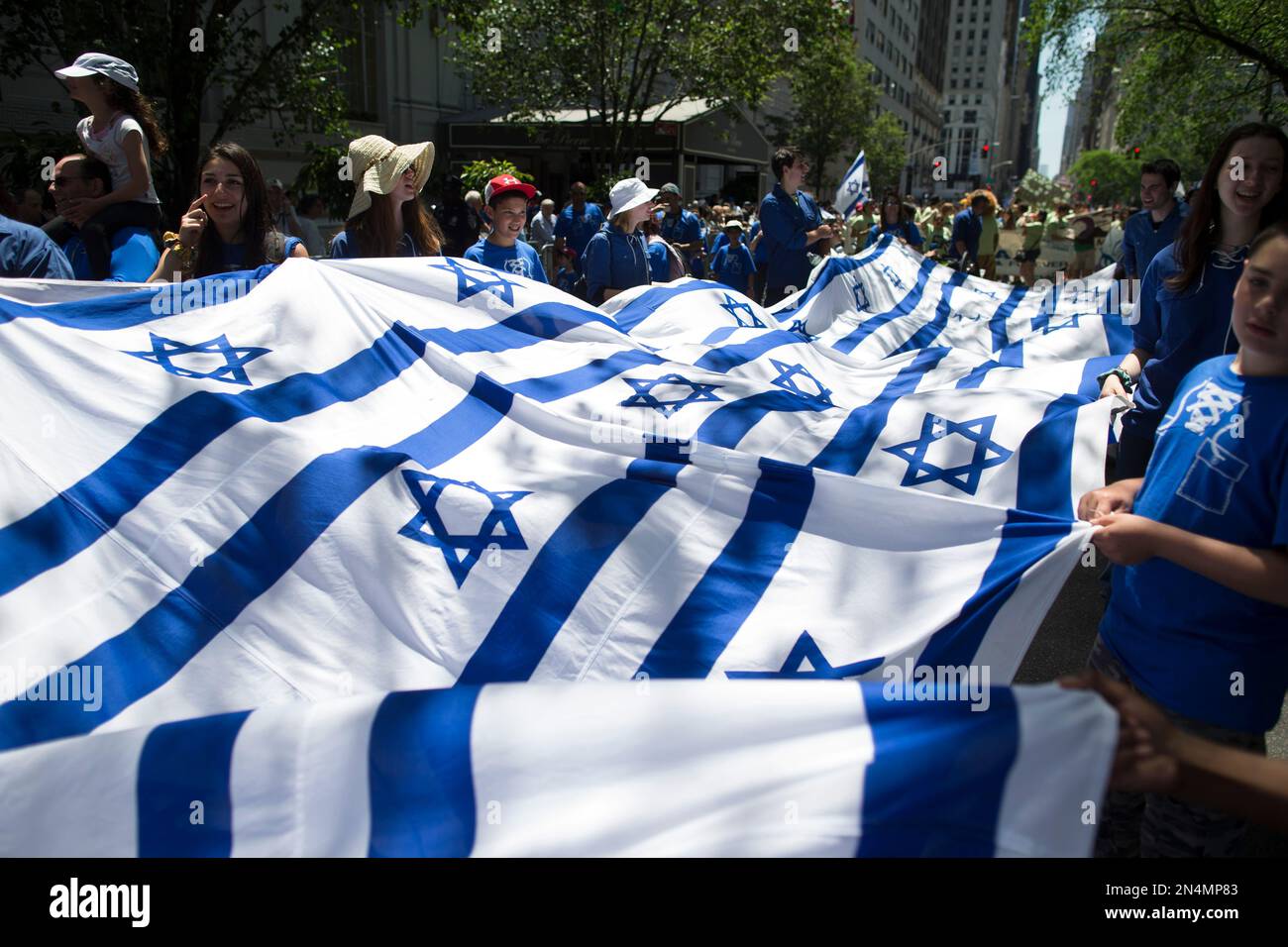 FILE - In this Sunday, June 1, 2014 file photo, revelers carry a banner ...